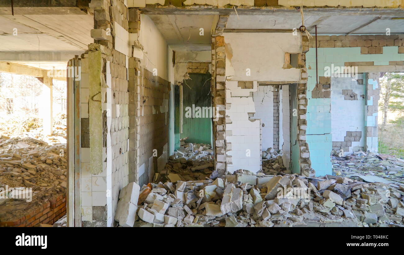 Scattered tiles and rubbles on the ground of the ruined house from the ...