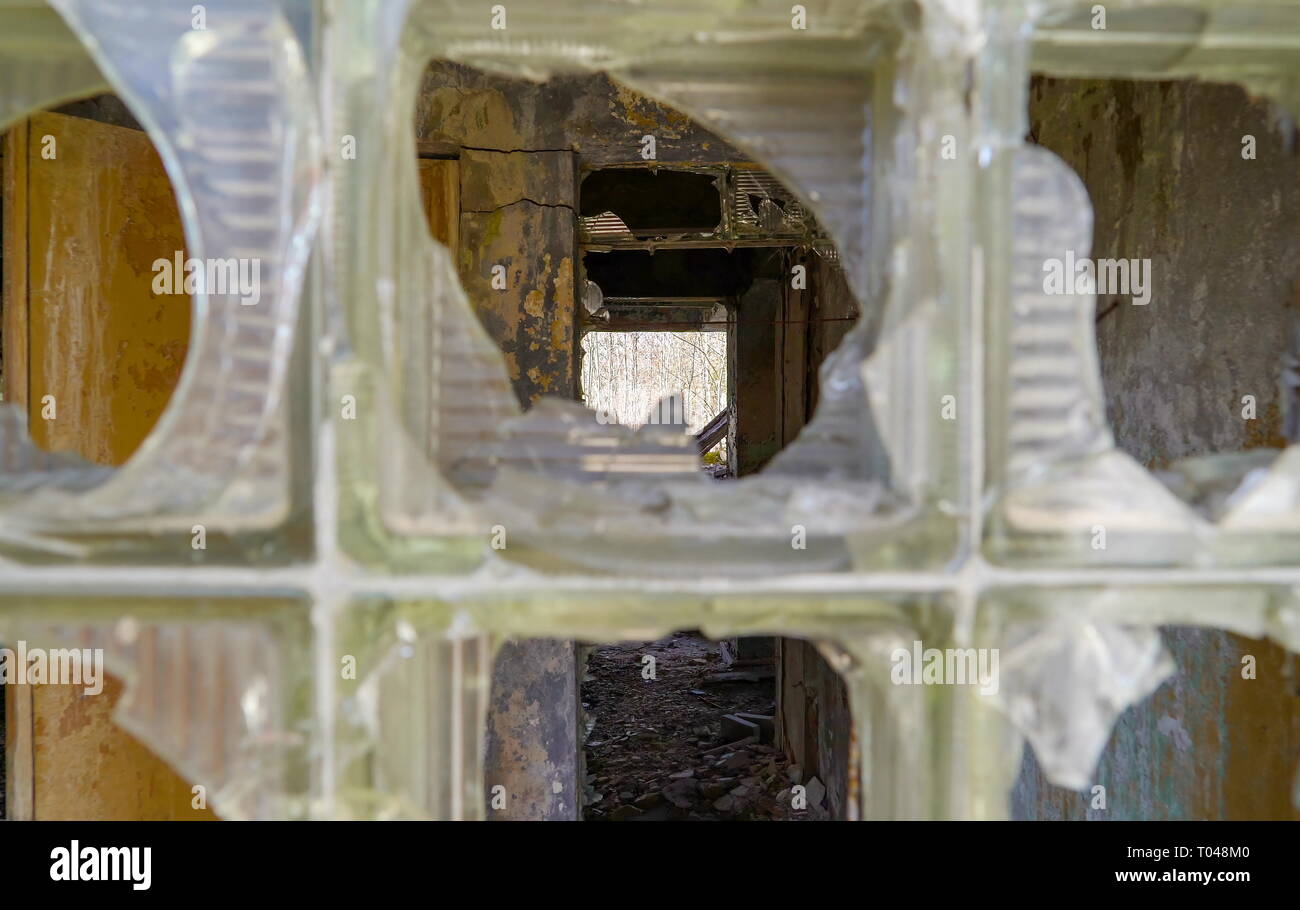 Looking through the window glass of the house that was broken from the ...