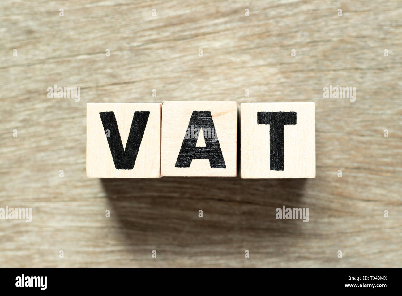 Letter block in word VAT (value added tax) on wood background Stock ...