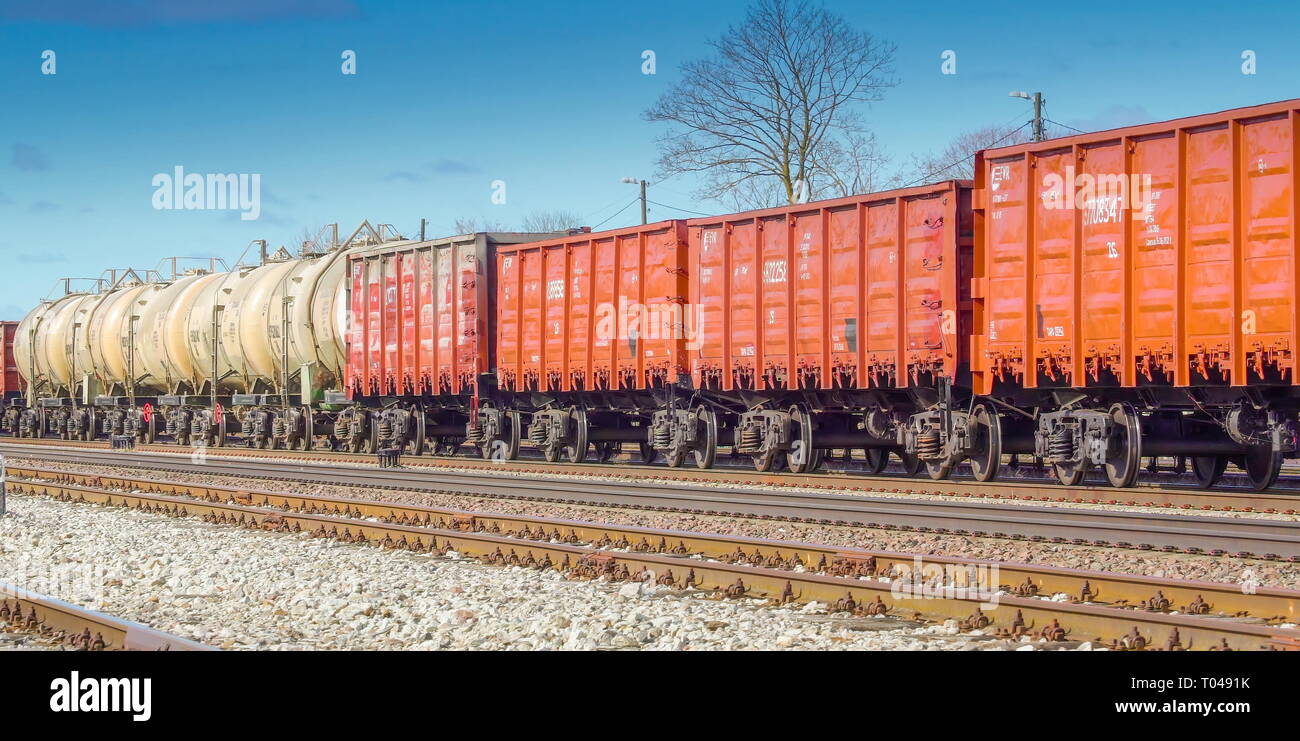 The many red wagons of the train inside the factory of the construction ...