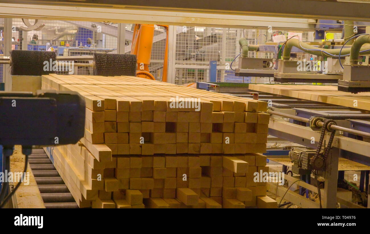 The process of planing the lumbers into the machine where piles of ...