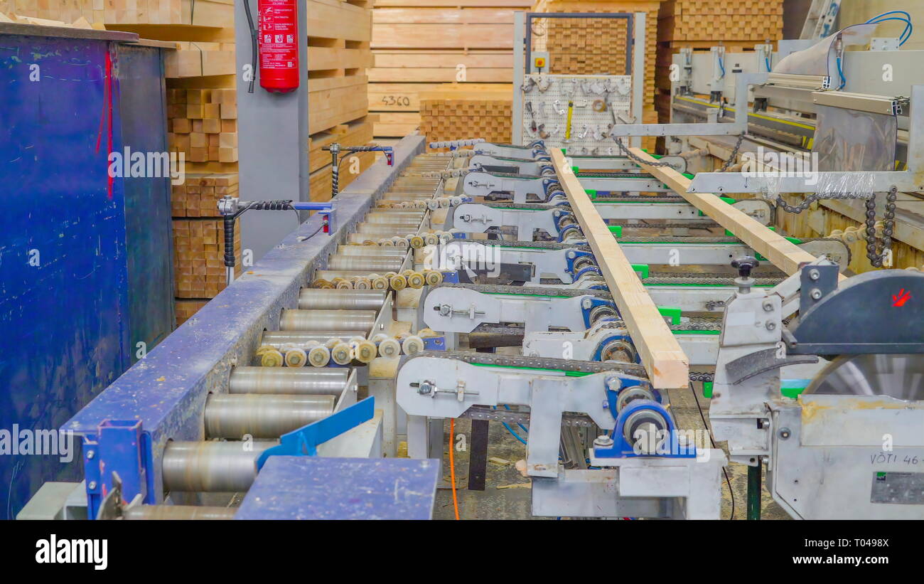 One of the many working machines inside the sawmill where seen the long ...