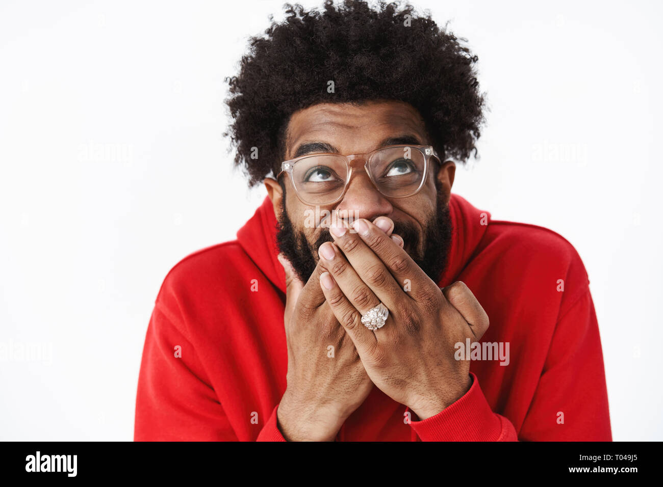 Waist-up shot of delighted happy african american male bearded friend ...