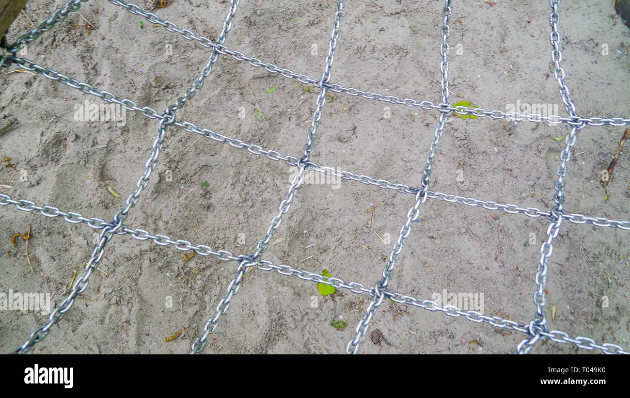 Top view of the hanging chains inside the zoo serves as obtacles or ...