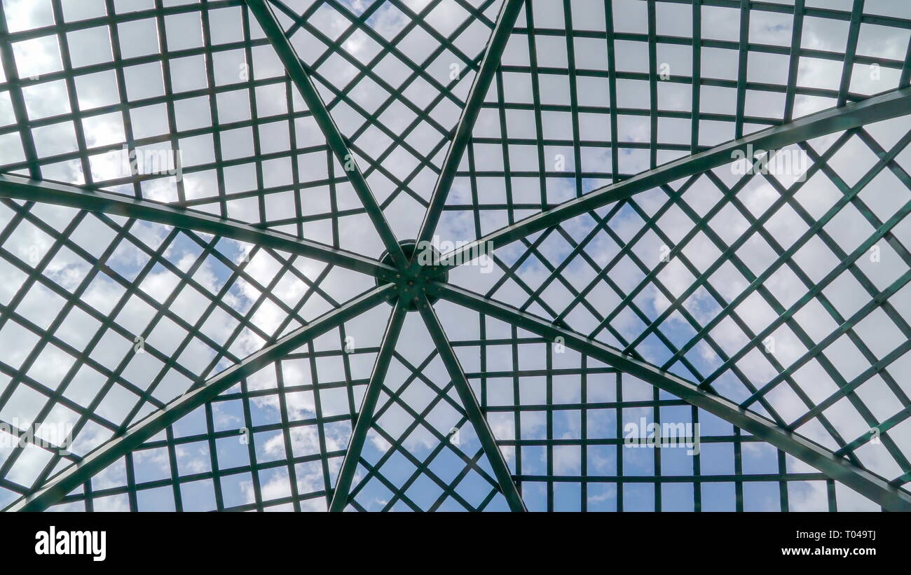 The roof of a shed inside the park in a net like structure the round ...