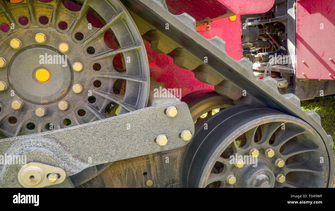 The triangle shape tire of the big harvester truck being displayed ...