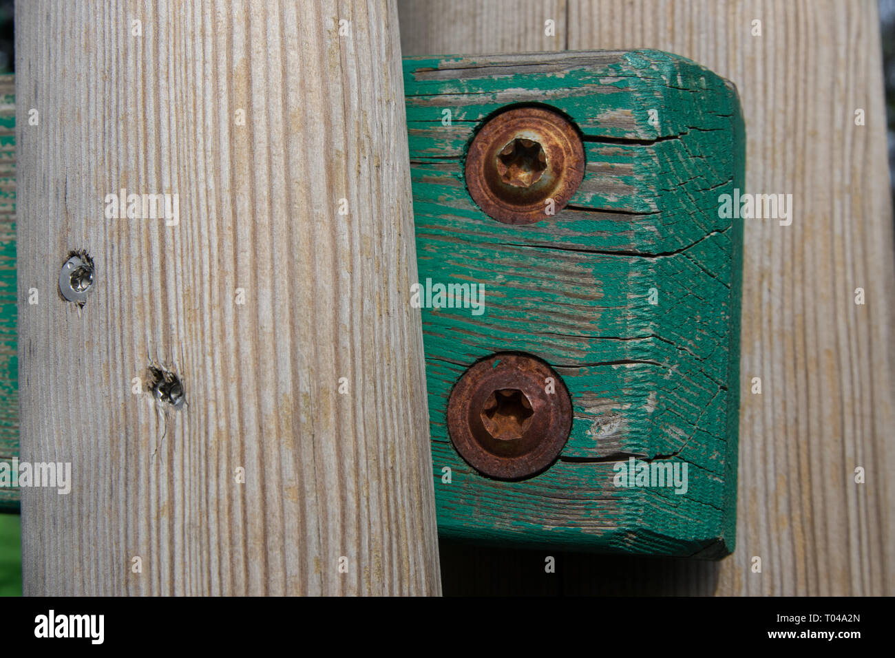 Playground wood structure with rusty screws Stock Photo - Alamy