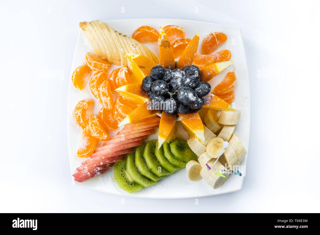 Mixed fruit in white plate isolated on white background - Healthy food ...