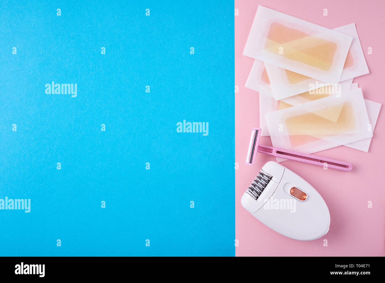 Epilator, razor for shaving and wax strips on blue and pink background ...