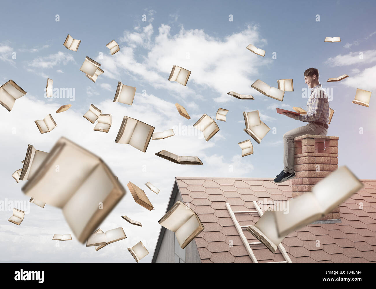 Man reading book and many of them flying in air Stock Photo - Alamy