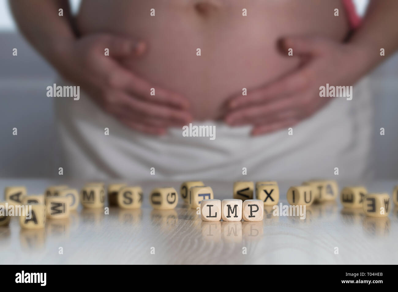 Abbreviation LMP composed of wooden letters for Last Menstrual Period ...