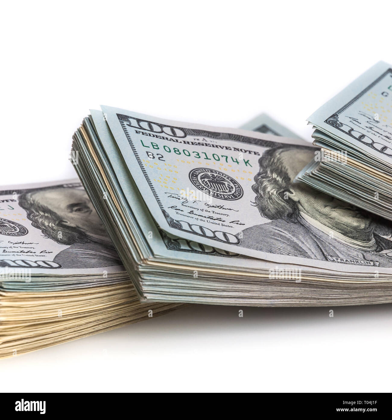 Banknotes of dollars in packs. Isolated white background Stock Photo ...
