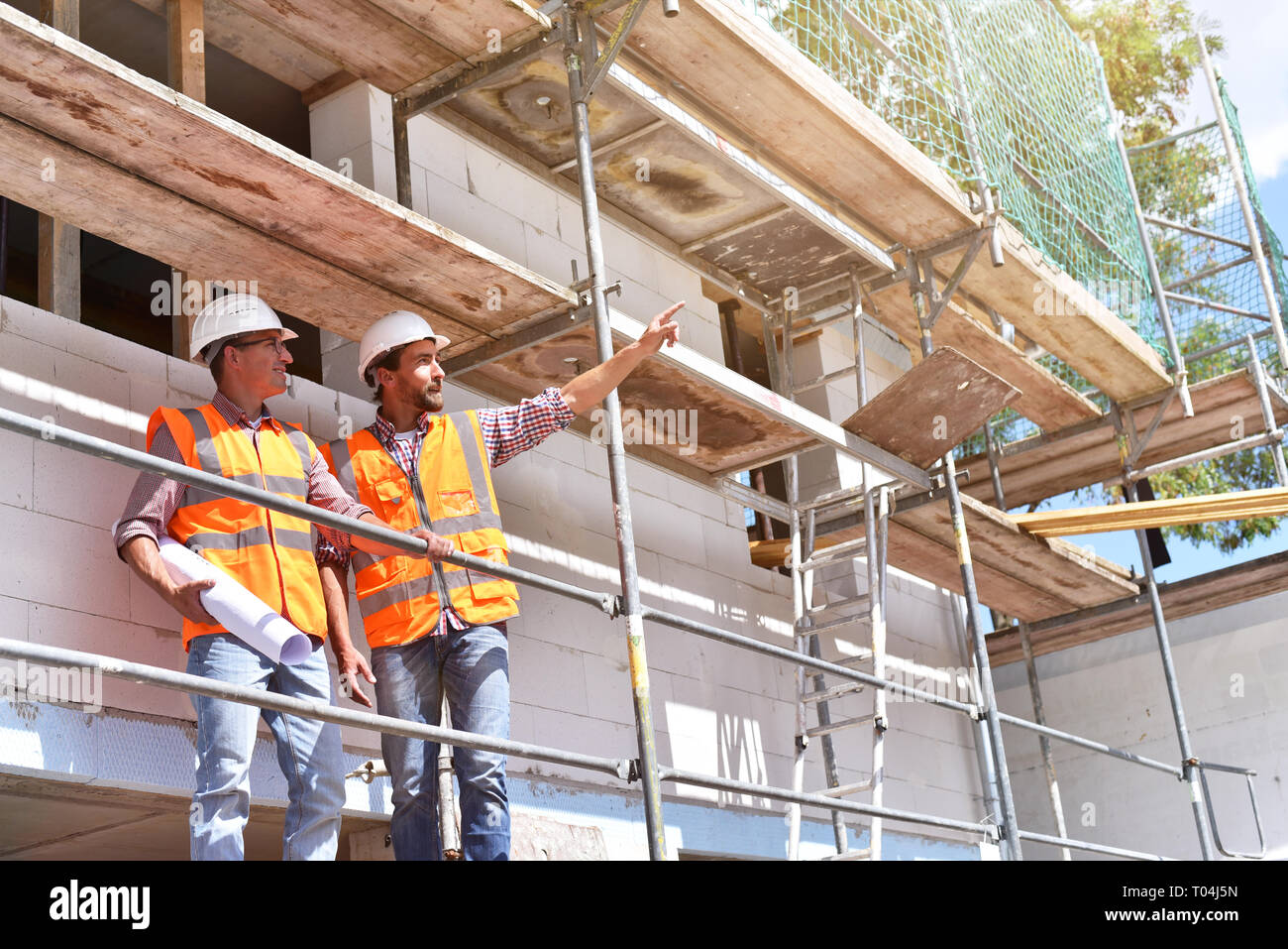 construction manager and architect on site during the construction of a ...