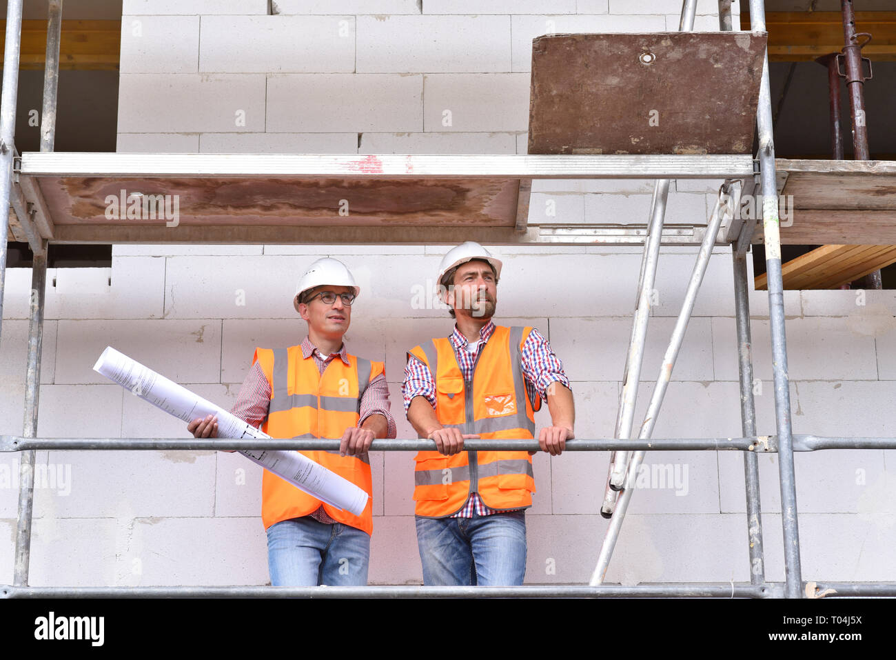 construction manager and architect on site during the construction of a ...