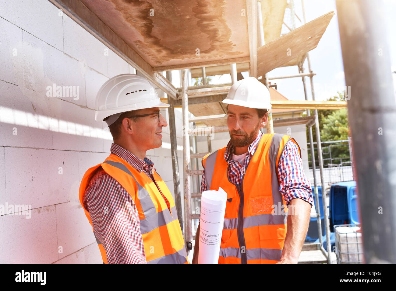 construction manager and architect on site during the construction of a ...