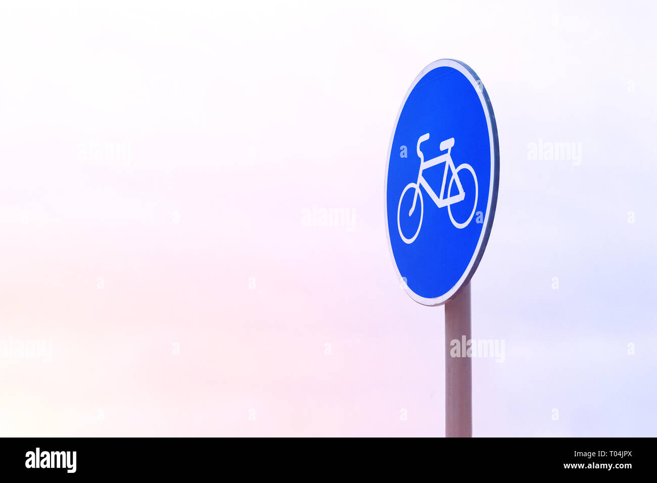 Bicycle sign in blue circle on light background with copyspace Stock ...
