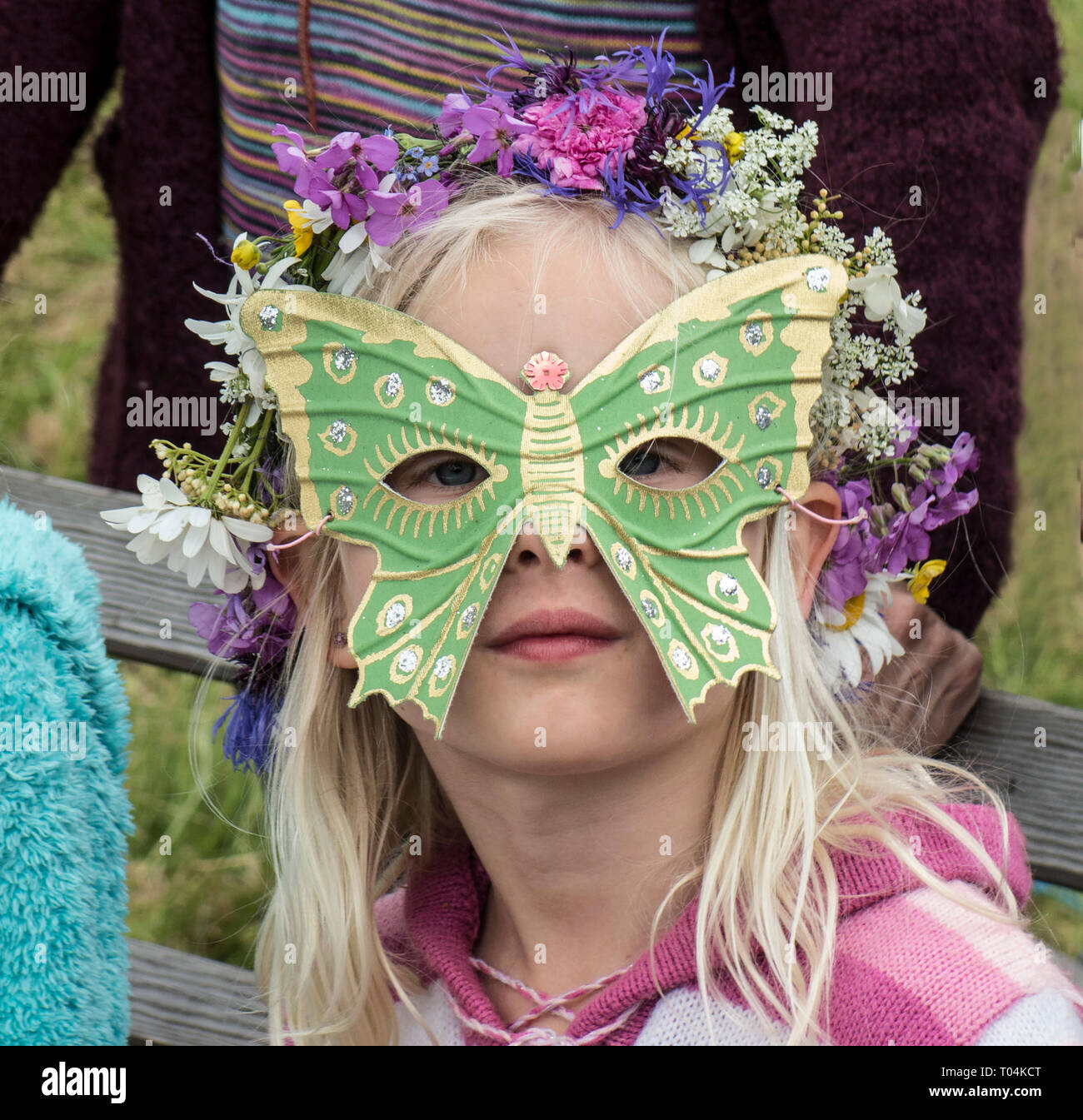 A young girl with a butterfly mask Stock Photo - Alamy