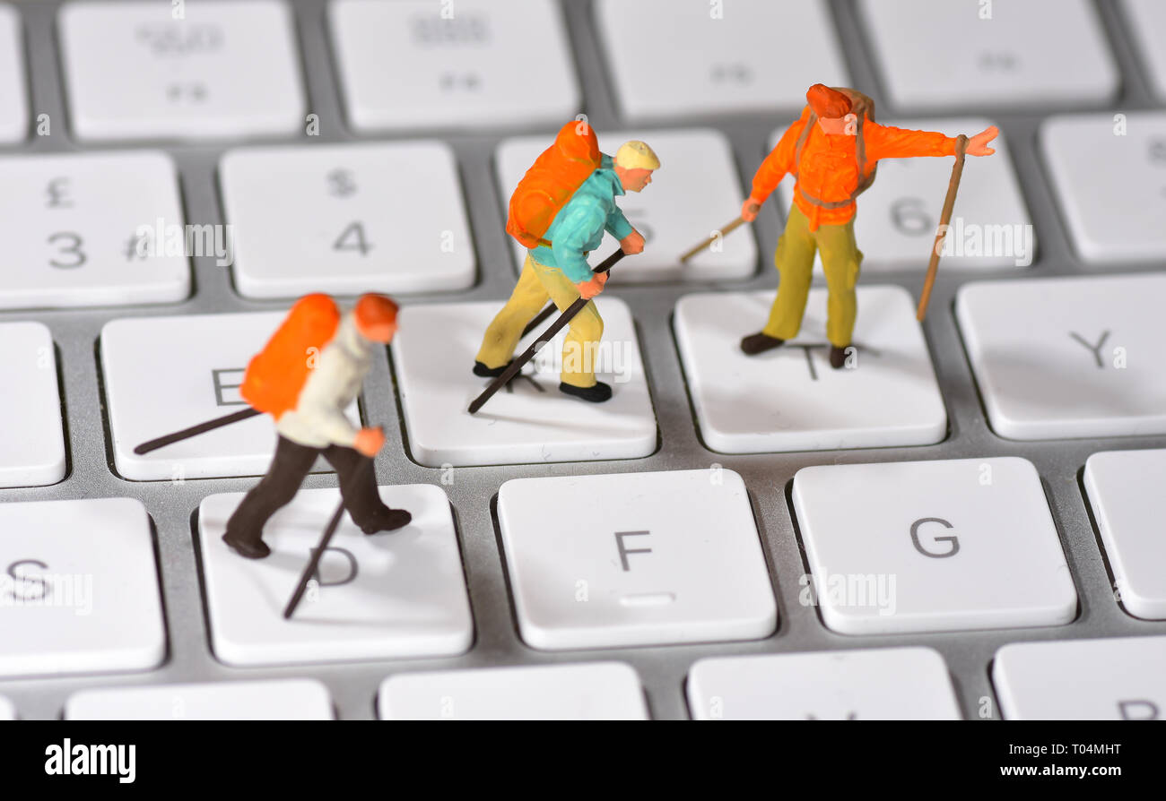 Hikers walking across a computer keyboard Stock Photo - Alamy