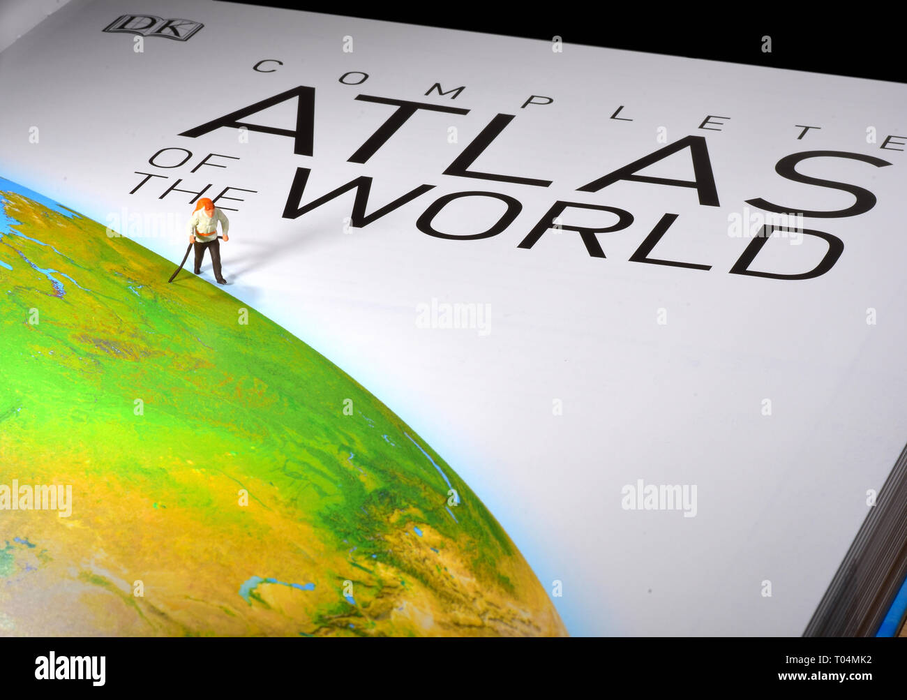 Miniature figures walking around the world Stock Photo - Alamy