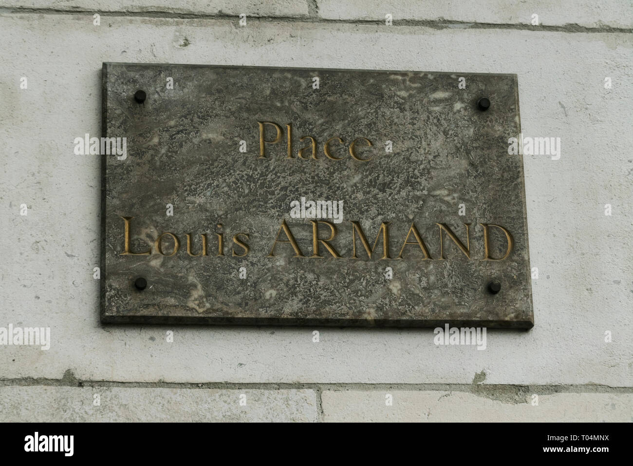 This decorative street name sign beside Gare-de-Lyon reflects the ...