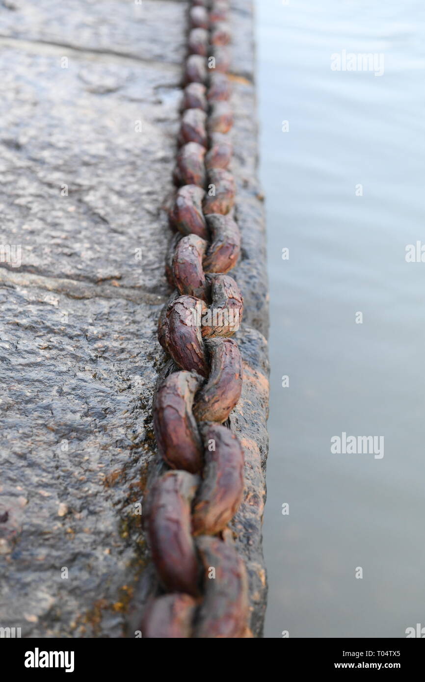 Chain with stone hi-res stock photography and images - Alamy