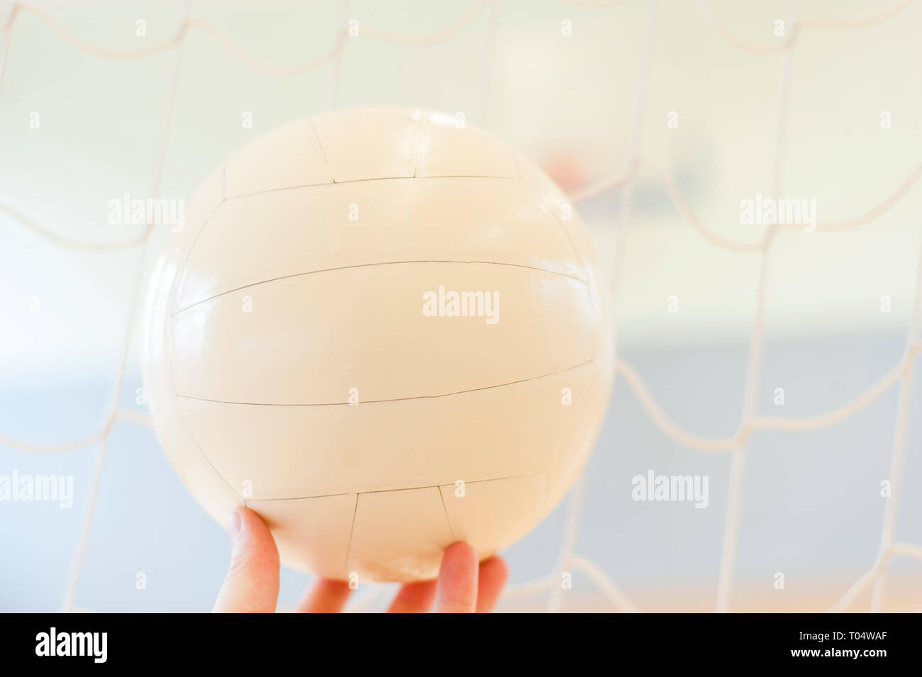 Volleyball ball in hand before start the game Stock Photo - Alamy
