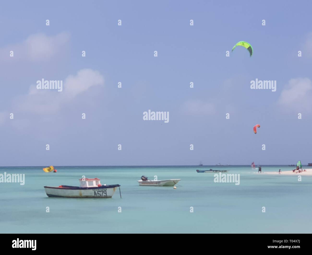 Romantic Aruban beach with fisher boats Stock Photo - Alamy