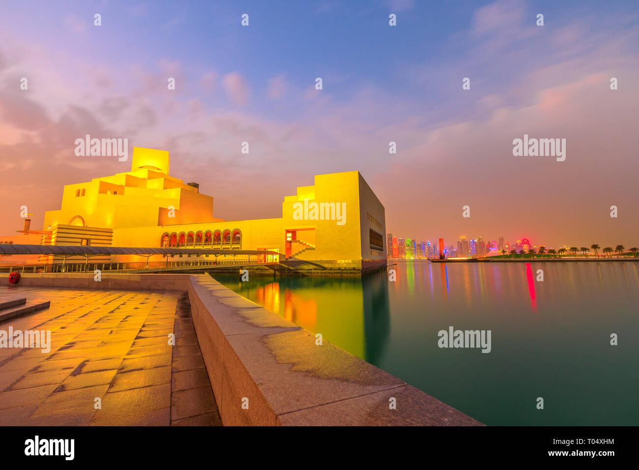 Doha seafront and West Bay skyline reflecting in Doha Bay along ...