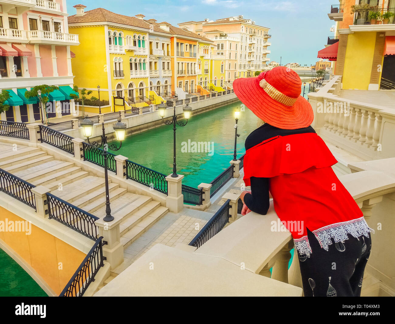 Aerial view of elegant woman looking Venice bridge in Doha, Qatar at ...