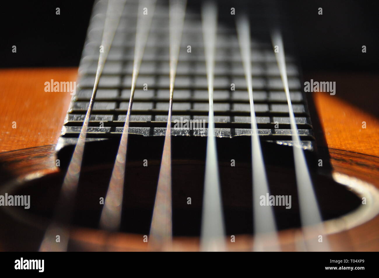 Classical guitar. Issuing a stringed instrument sounds. Fretboard ...