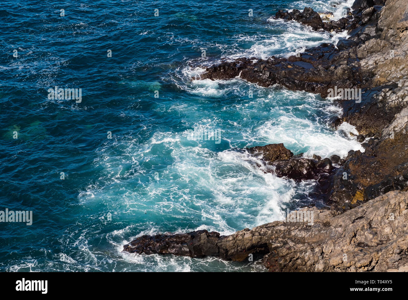 beautiful view on blue ocean water and rocky coast line Stock Photo - Alamy