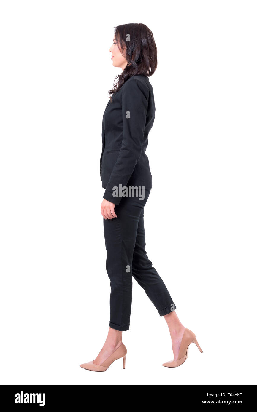 Profile view of elegant business woman in suit stepping forward. Full ...