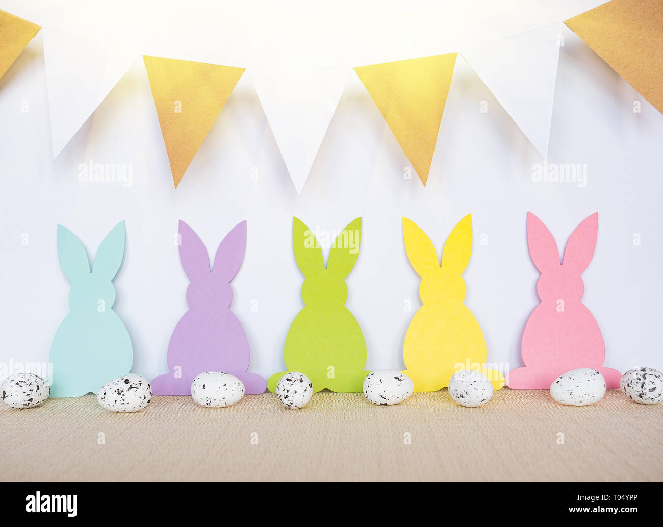 Easter background with eggs, rabbits and garland flags Stock Photo - Alamy
