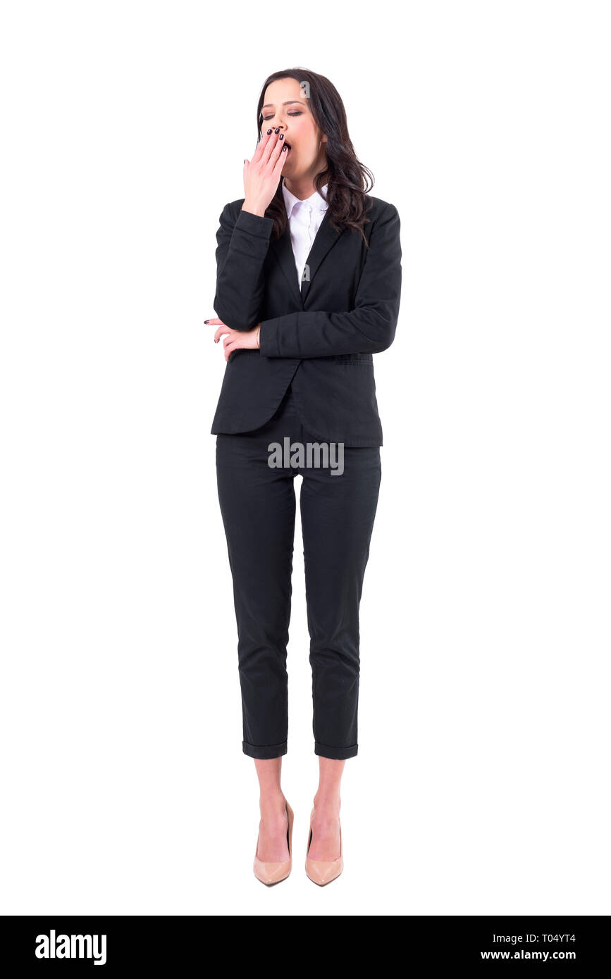 Tired sleepy overworked business woman in black suit yawning with ...