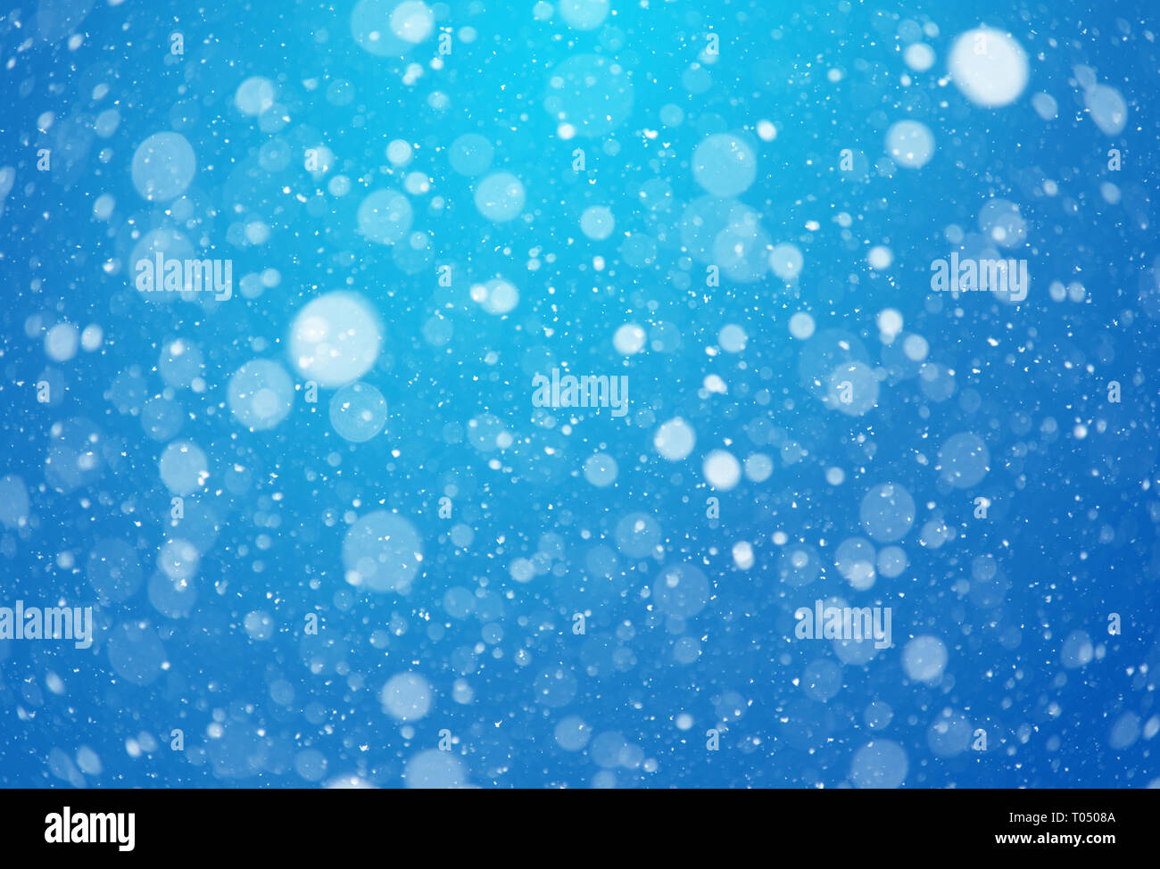 Snow falling light blue background hi-res stock photography and images ...