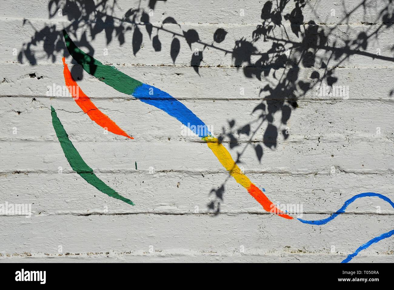 Colourful lines on white wall Stock Photo - Alamy