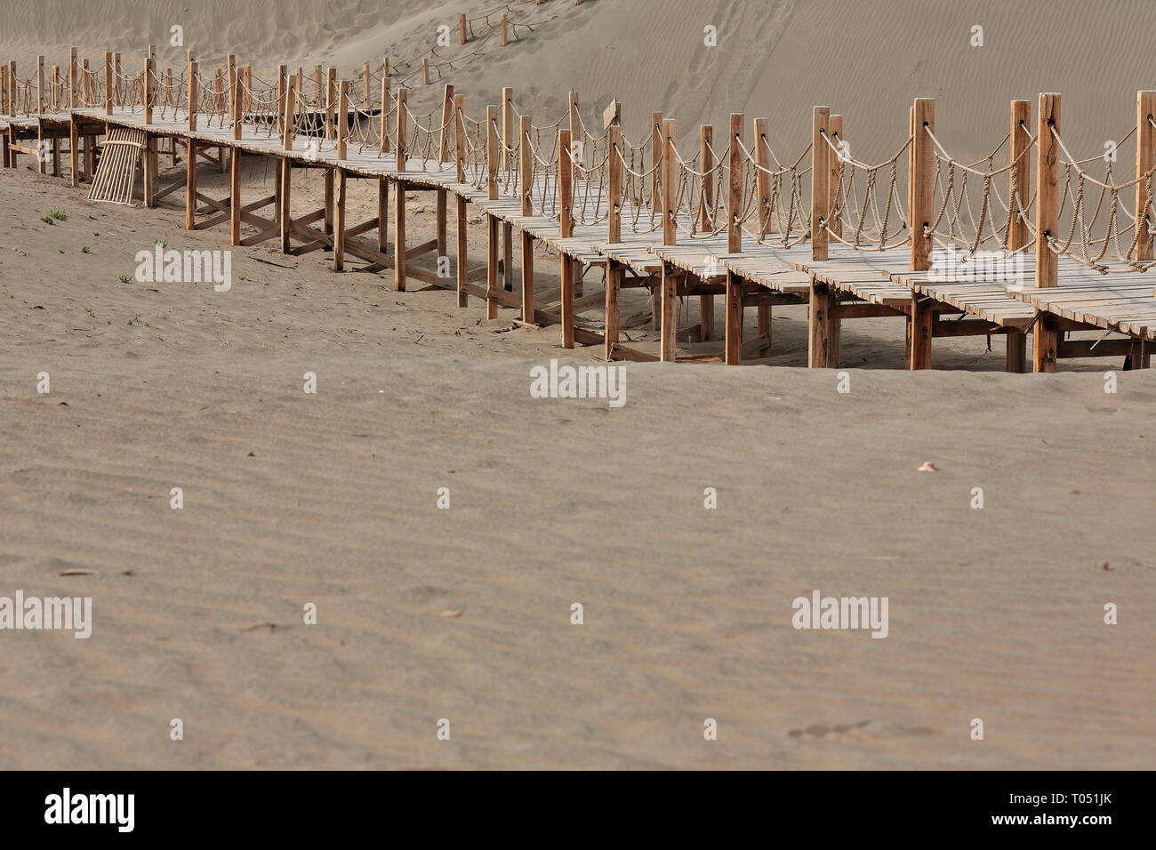 Wooden boardwalks-walkways for visiting the Rawak Stupa. Taklamakan ...