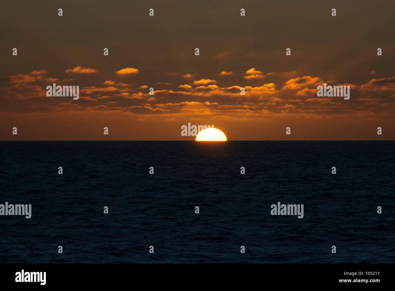 Ocean between Falkland and South Georgia Islands, orange sunset at sea ...