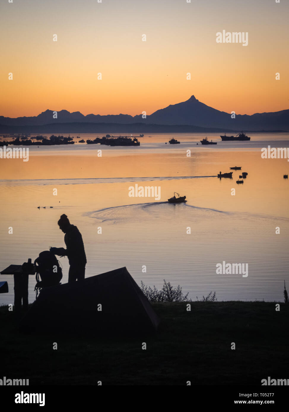 Sunrise in the harbour of Quellon in Chiloe Island. Patagonia in Chile ...