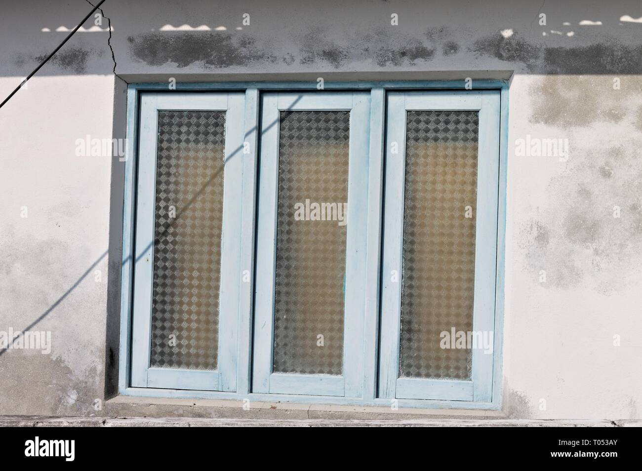 Three windows in a broken wall (Ari Atoll, Maldives Stock Photo - Alamy