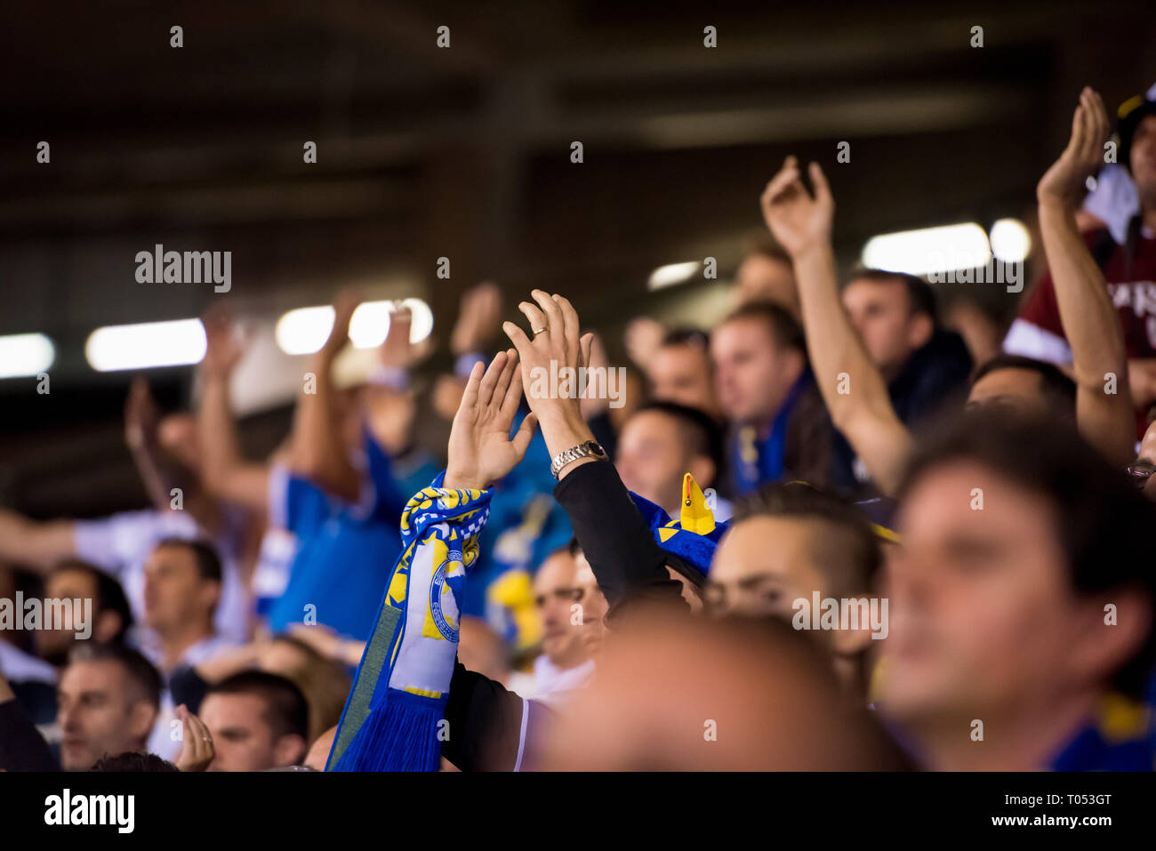 Football fans hands clapping while supporting their team on the podium ...