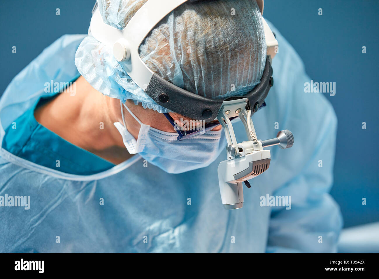 Close up portrait of female surgeon doctor wearing protective mask and ...