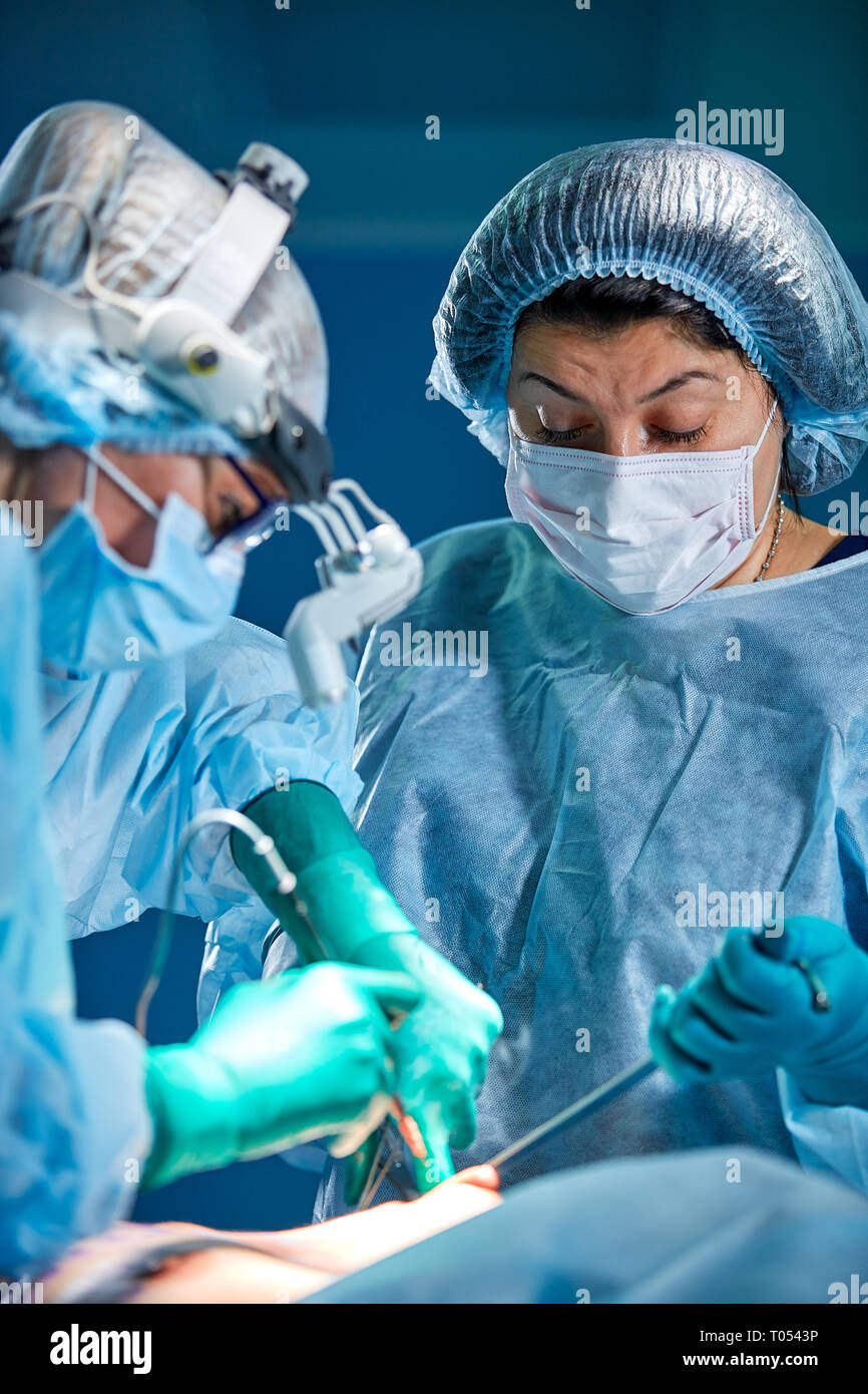Team of surgeons makes an invasive operation. Portrait of surgeons ...