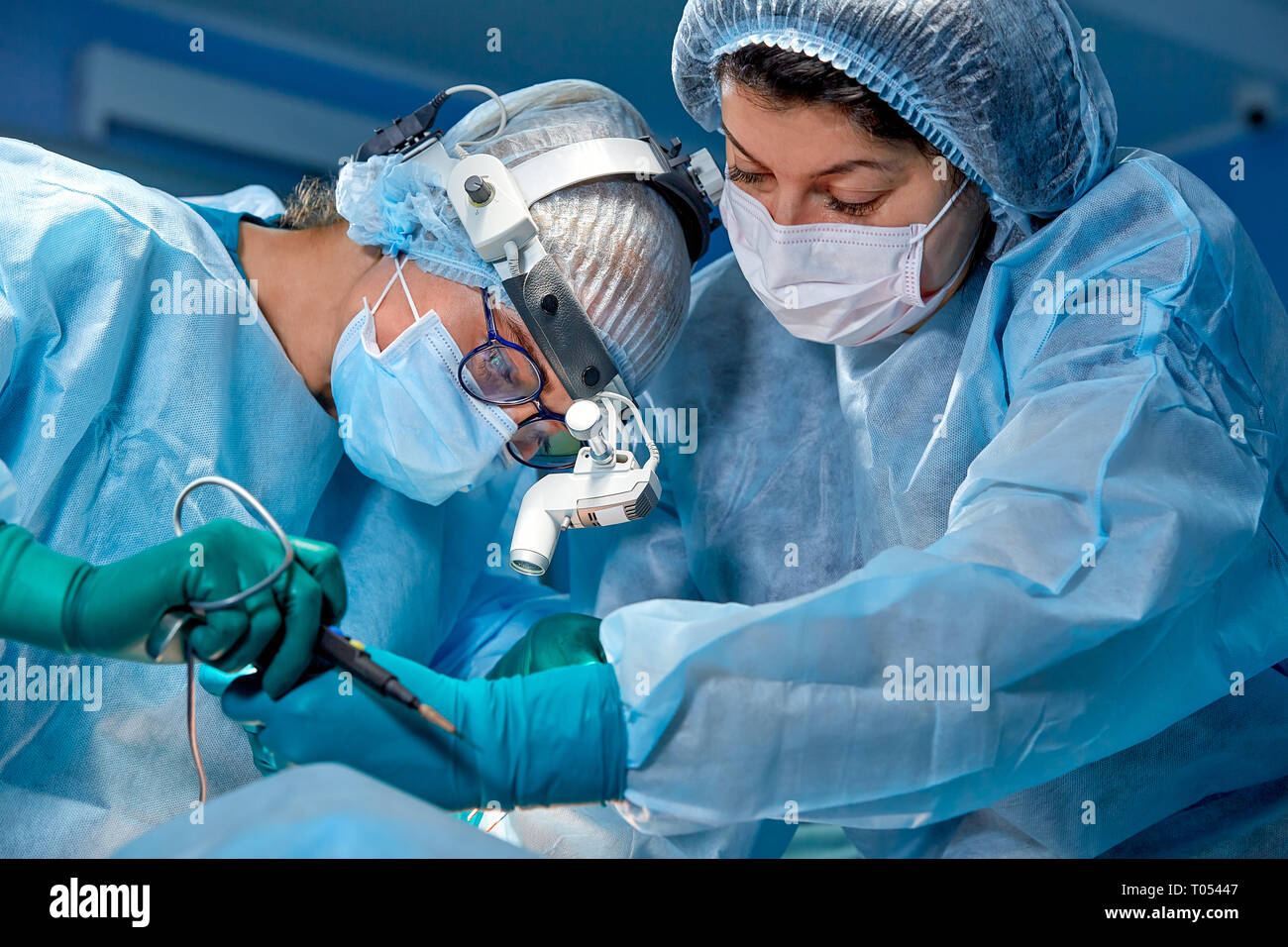Team of surgeons makes an invasive operation. Portrait of surgeons ...