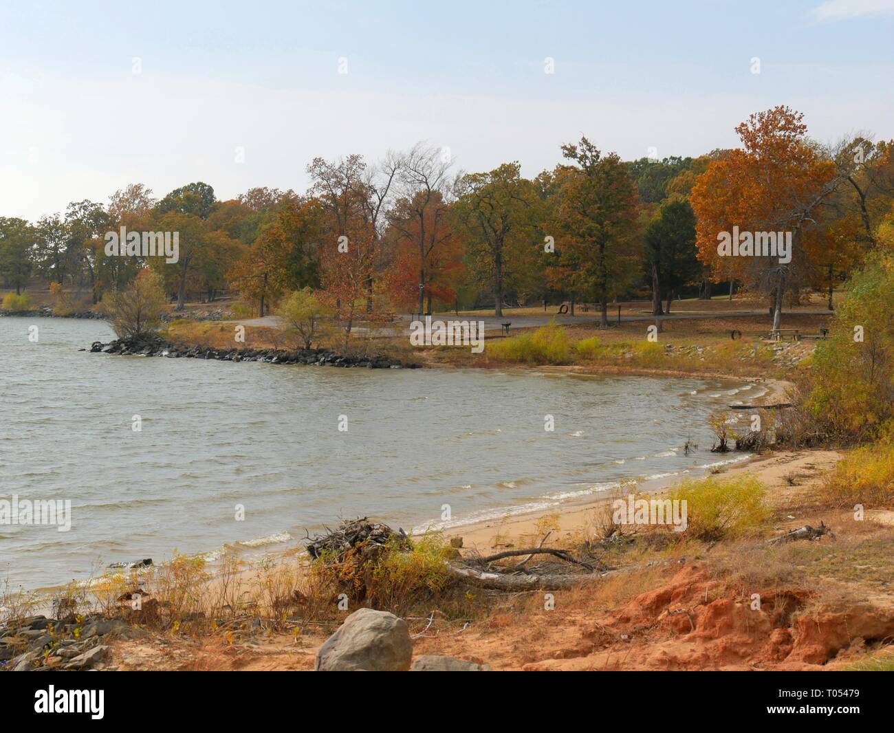 Scenic lakeside view with autumn colors in the trees Stock Photo - Alamy