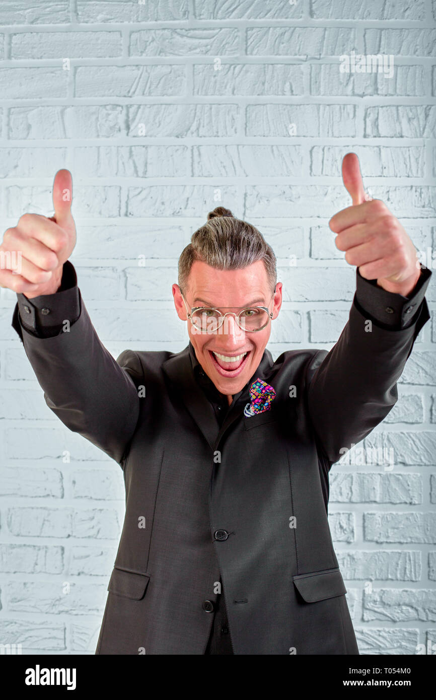 Positive confident businessman smiling looking at camera showing hand ...