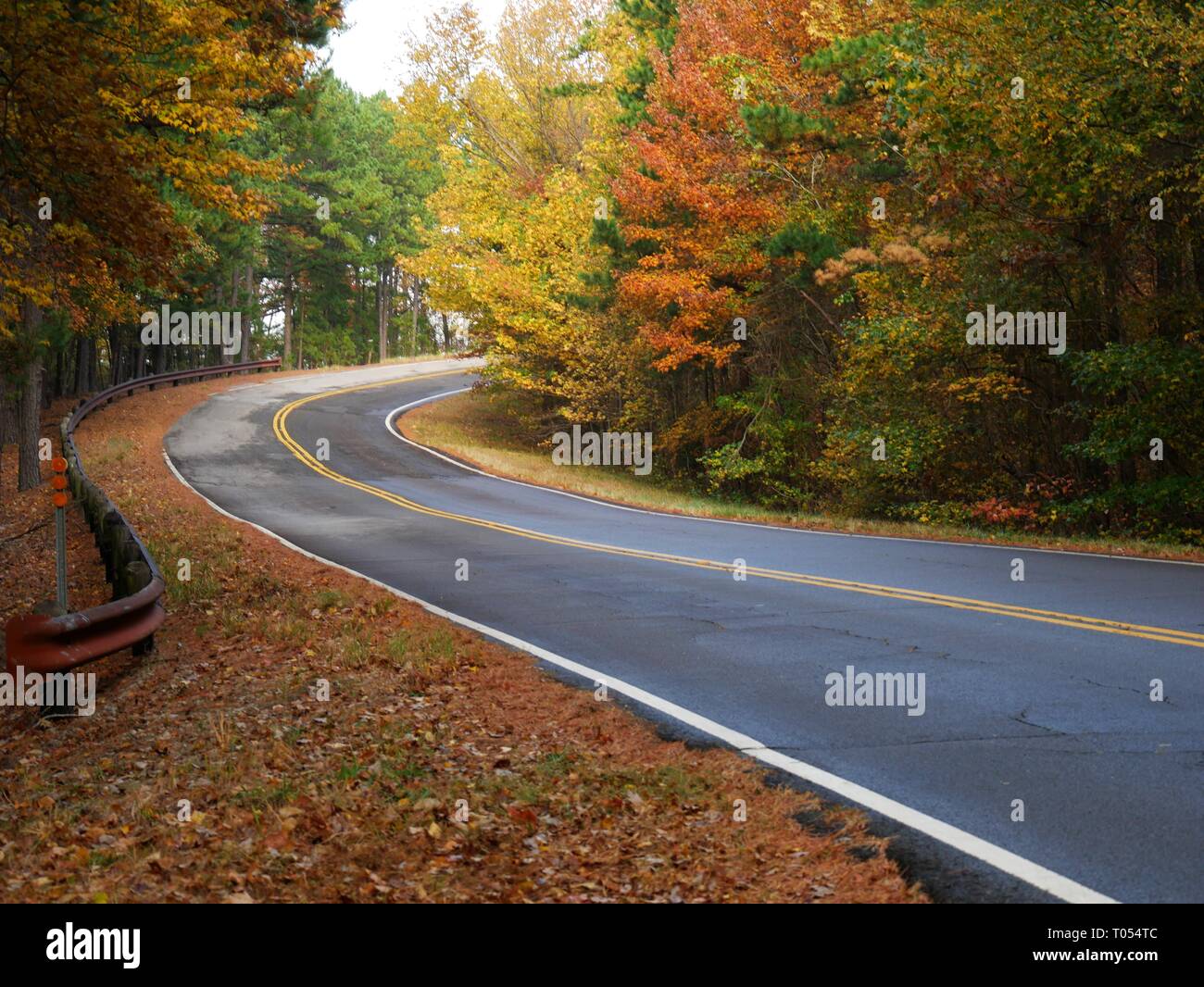 Dramatic shot of curbing roadside view at the Talimena National Scenic ...