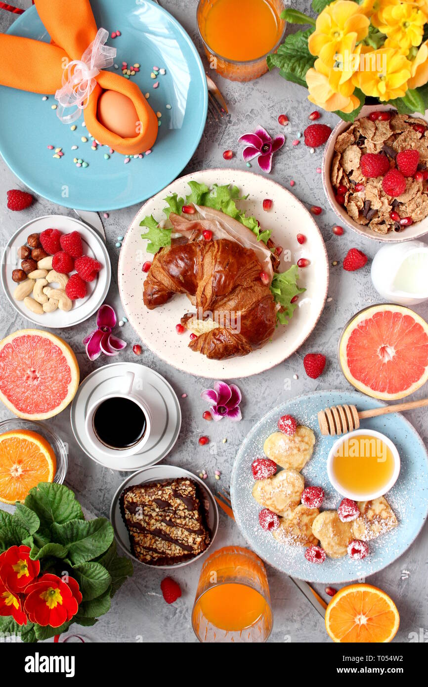 Breakfast food table. Festive brunch set, meal variety with pancakes ...