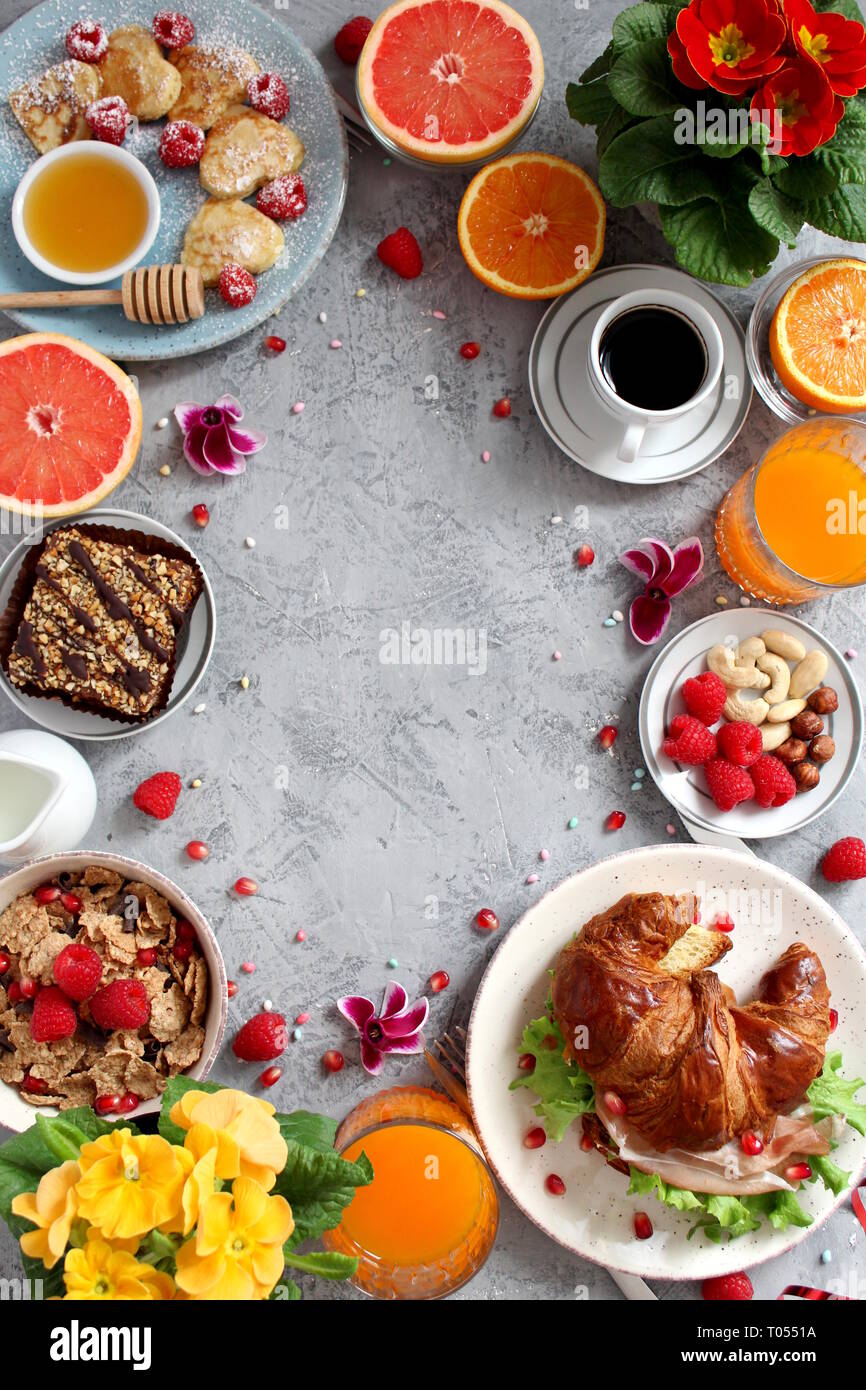 Breakfast food table. Festive brunch set, meal variety with pancakes ...
