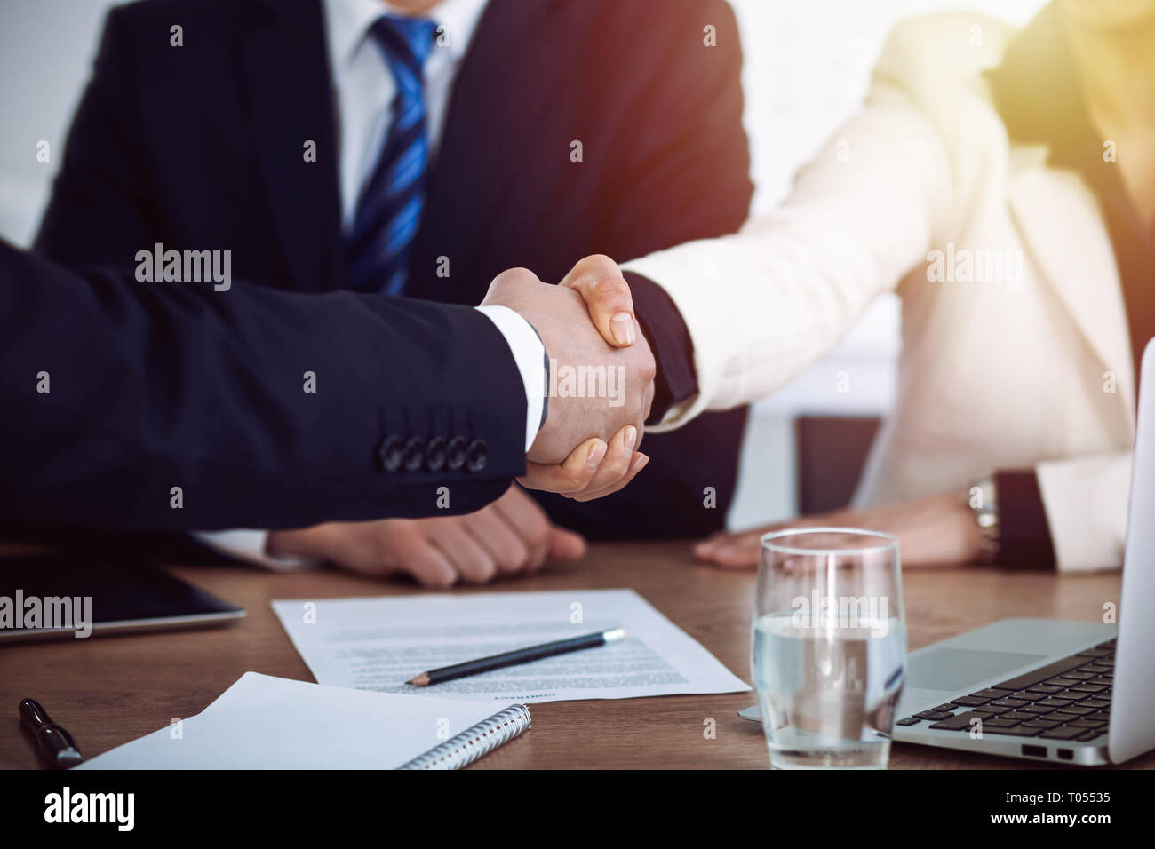 Business people shaking hands at meeting or negotiation in the office ...